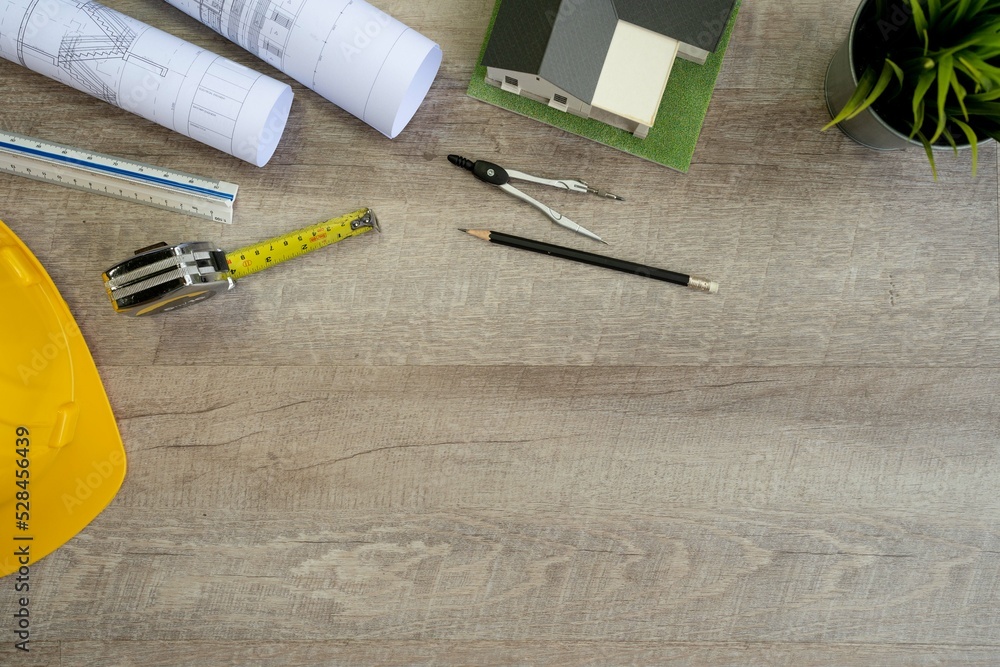 Flat lay of top view desk work table Engineer with Blueprint drawing ...