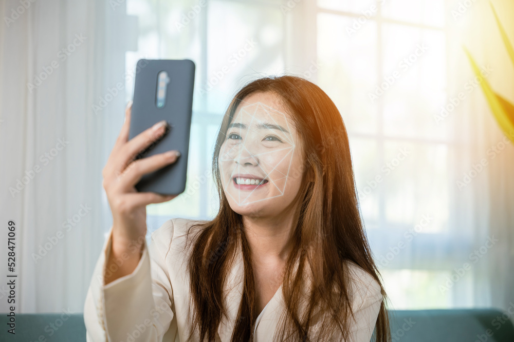 Asian women use smartphone for access control face recognition in ...
