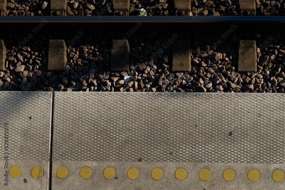 Copenhagen, Denmark Train tracks and a patterned platform for safety ...