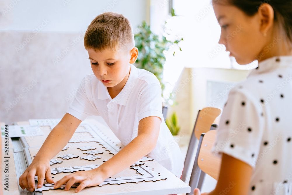 Creativity and logical thinking. Children ptimary school at classroom ...