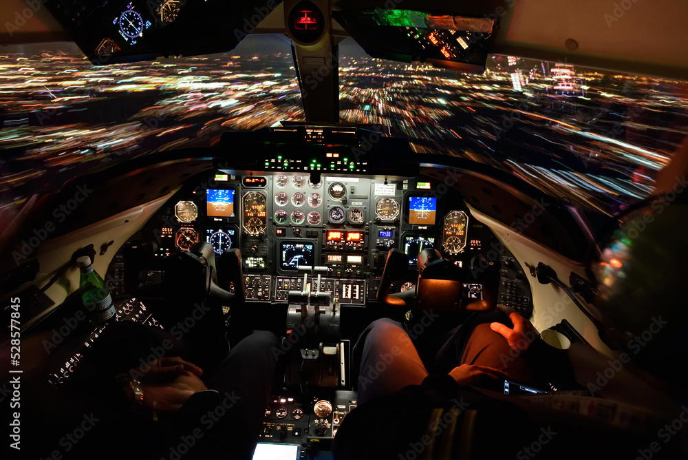 Cockpit of Business Jet at night with light trails Stock Photo | Adobe ...