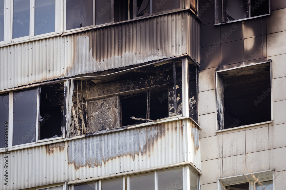 Consequences of a fire in a residential high-rise building. Burnt ...