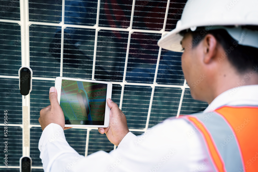 The engineer takes the Thermoscan(thermal image camera) scan to the ...