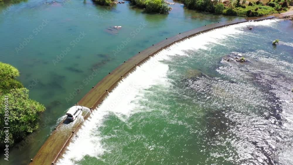 Aerial landscape view of a car driving on Ivanhoe Crossing a concrete ...