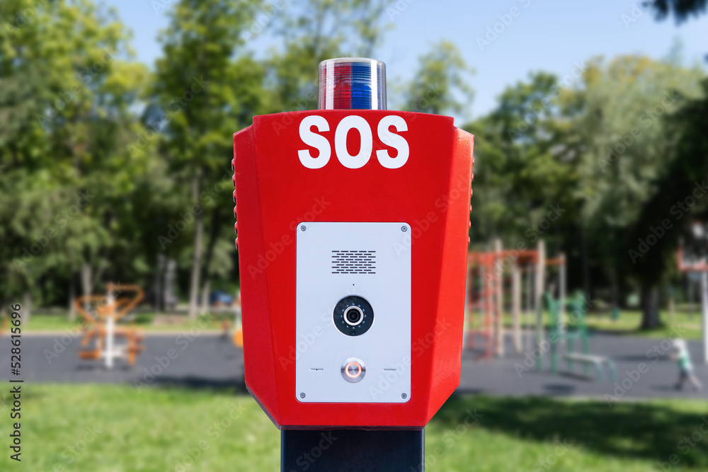 SOS, police, emergency button in the public park. Stock Photo | Adobe Stock