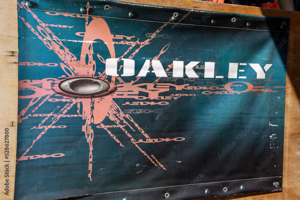 oakley logo sign and brand text on banner wall store facade clothing ...