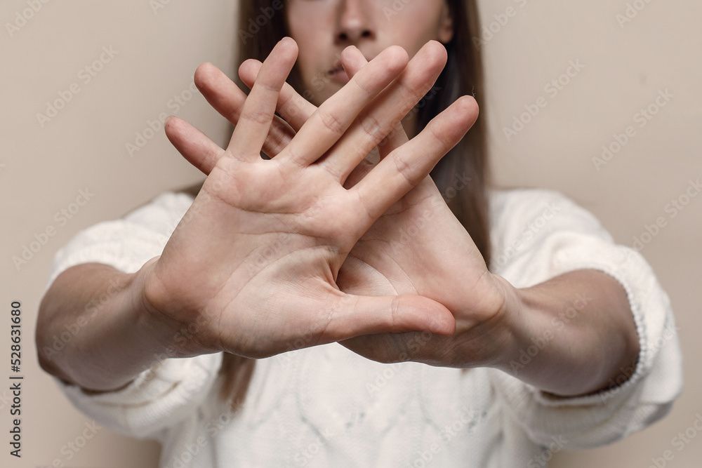 Woman's palm close up, gesture stop and don't move, stop domestic ...
