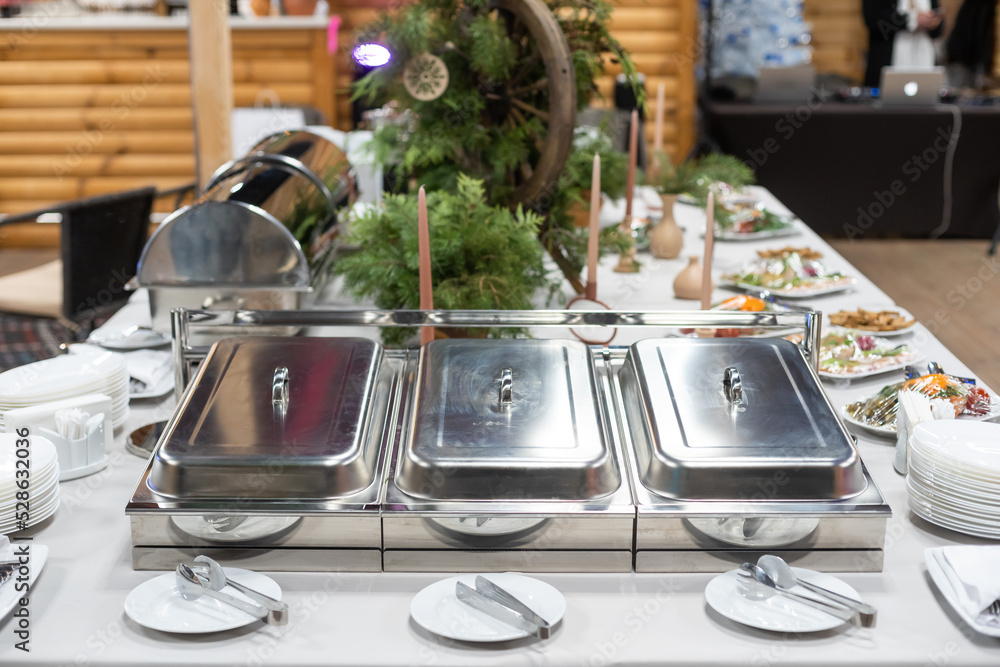 Food trays in buffet. metal containers buffet table. Stock Photo ...