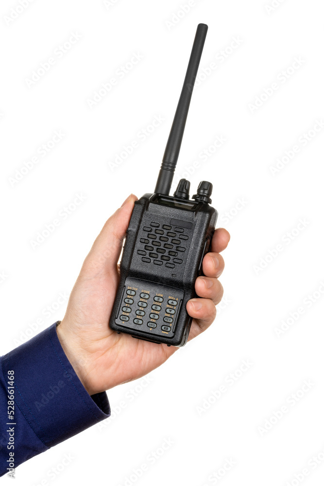 Man's hand holding walkie-talkie, handheld radio communication device ...