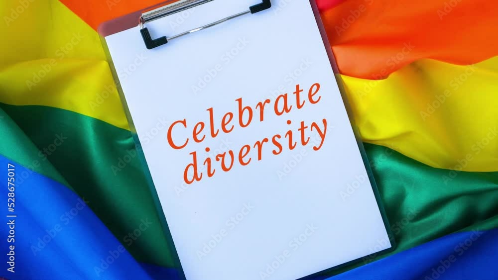 4k zoom in out Rainbow flag with text CELEBRATE DIVERSITY message paper ...