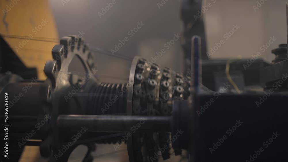 Close-up of the cable weaving. The complex mechanism rotates rapidly ...