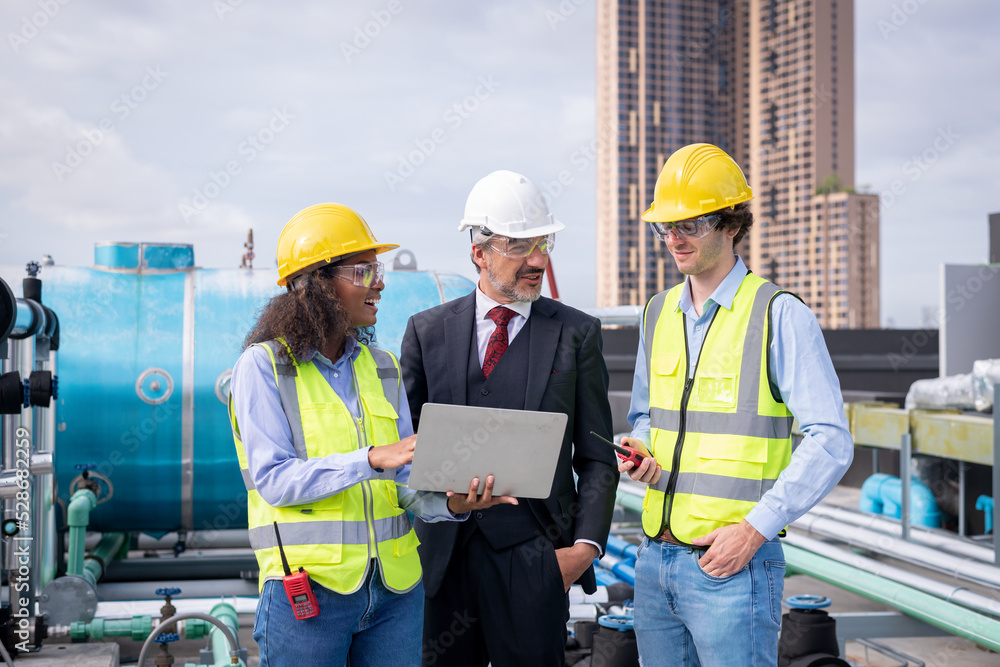engineer under checking the industry cooling tower air conditioner is ...