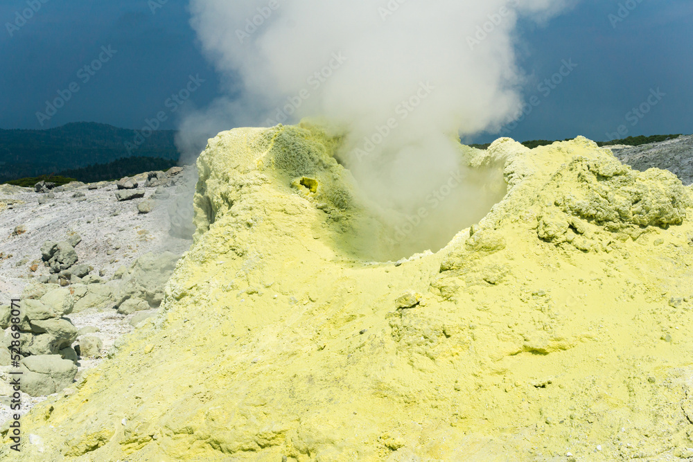 cone of sulfur deposits around a fumarole in a solfataric field ...