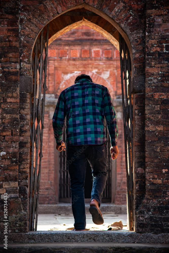 Man entering Sura mosque to pray Stock Photo | Adobe Stock