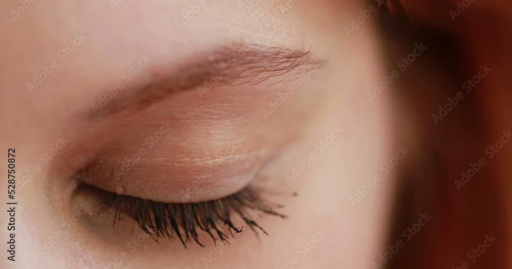 Closeup of girl eyes, young woman opening, blinking, and closing eye ...