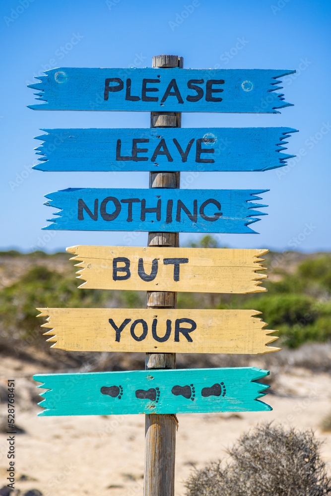 Colorful sign with message "Please leave nothing but your footprints ...