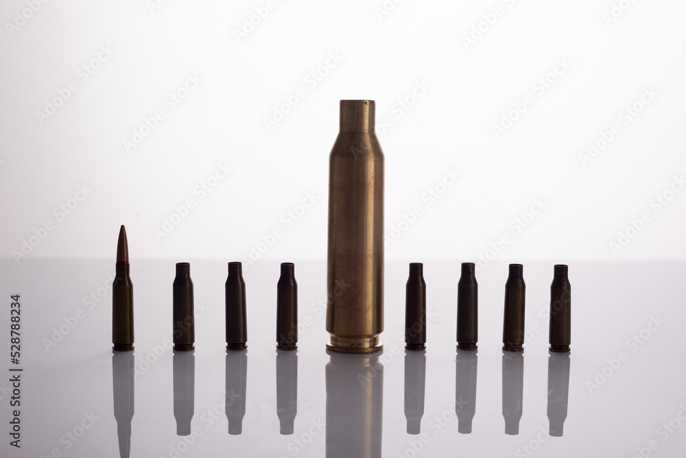 used spent shells of cartridges from a machine gun and a machine gun on ...