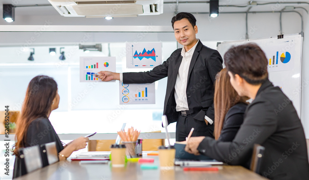 Asian handsome professional successful businessman presenter standing ...