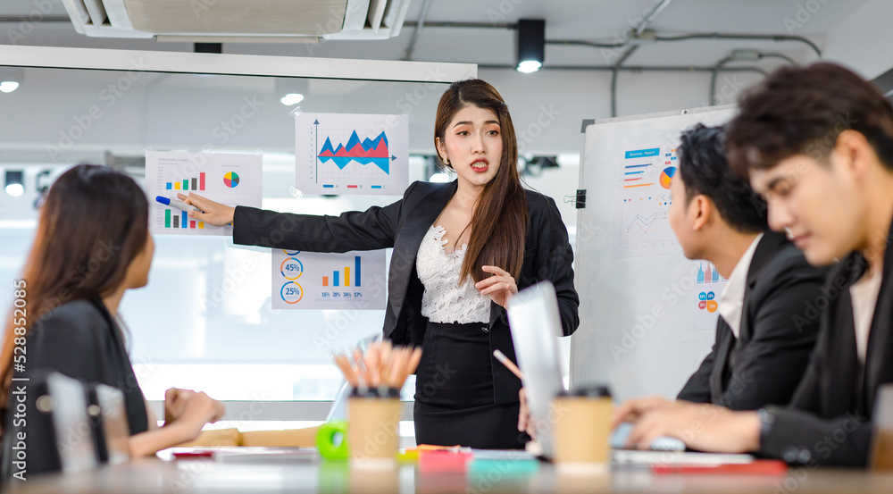 Asian young beautiful professional successful businesswoman presenter ...