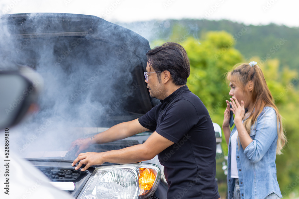 Car engine overheating, smoke out from engine front hood man help to ...