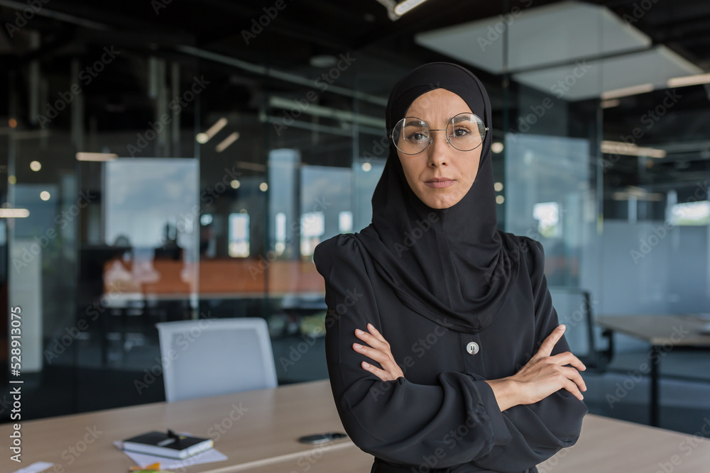 Portrait of female boss in hijab, successful businesswoman serious and ...