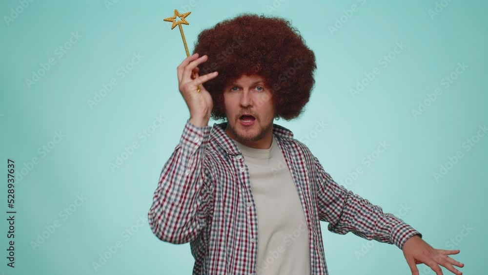 Magician wizard man gesturing with magic wand fairy stick, making wish ...