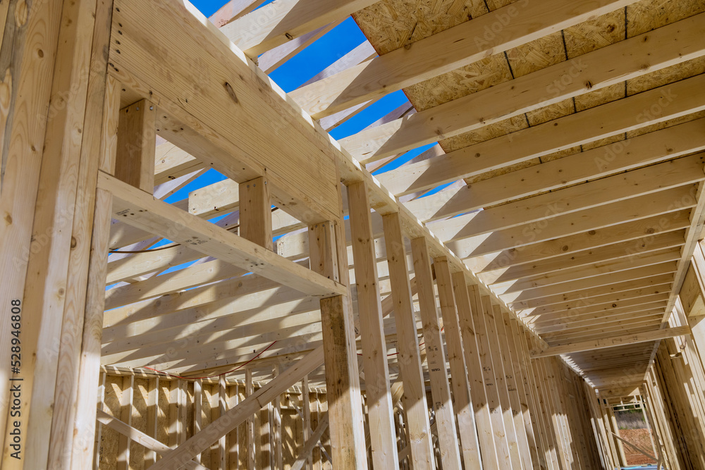 Typical wood framing beams stick framing of new home that is currently ...