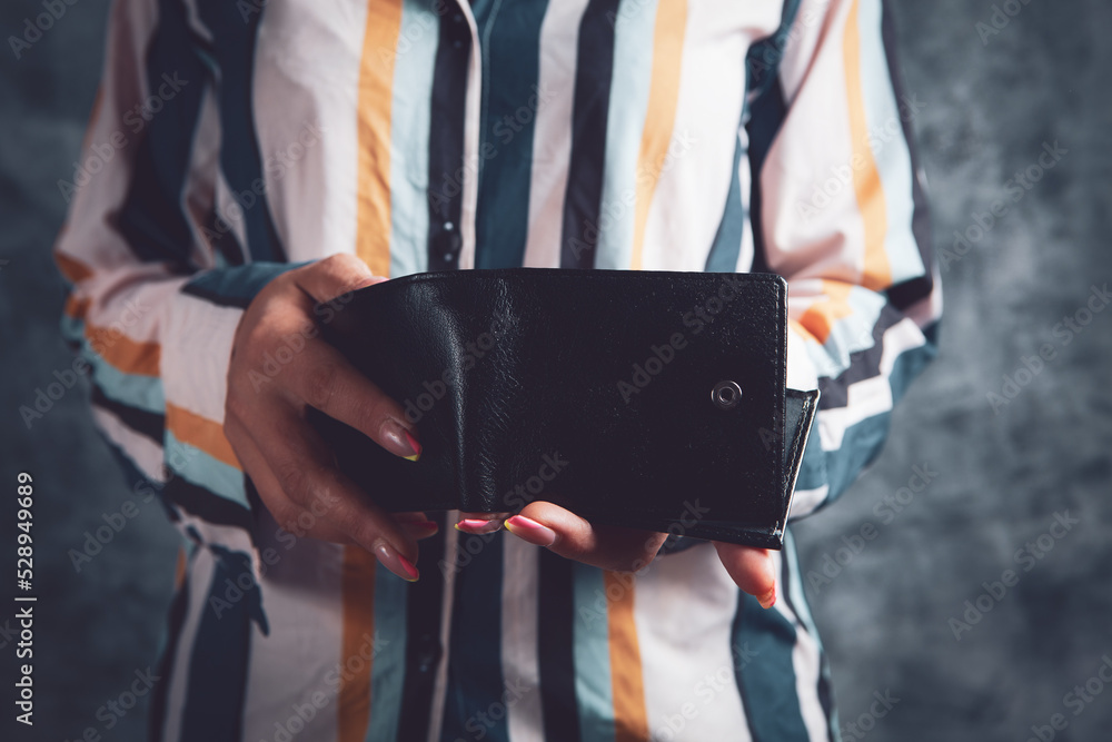 young girl showing empty wallet Stock Photo | Adobe Stock