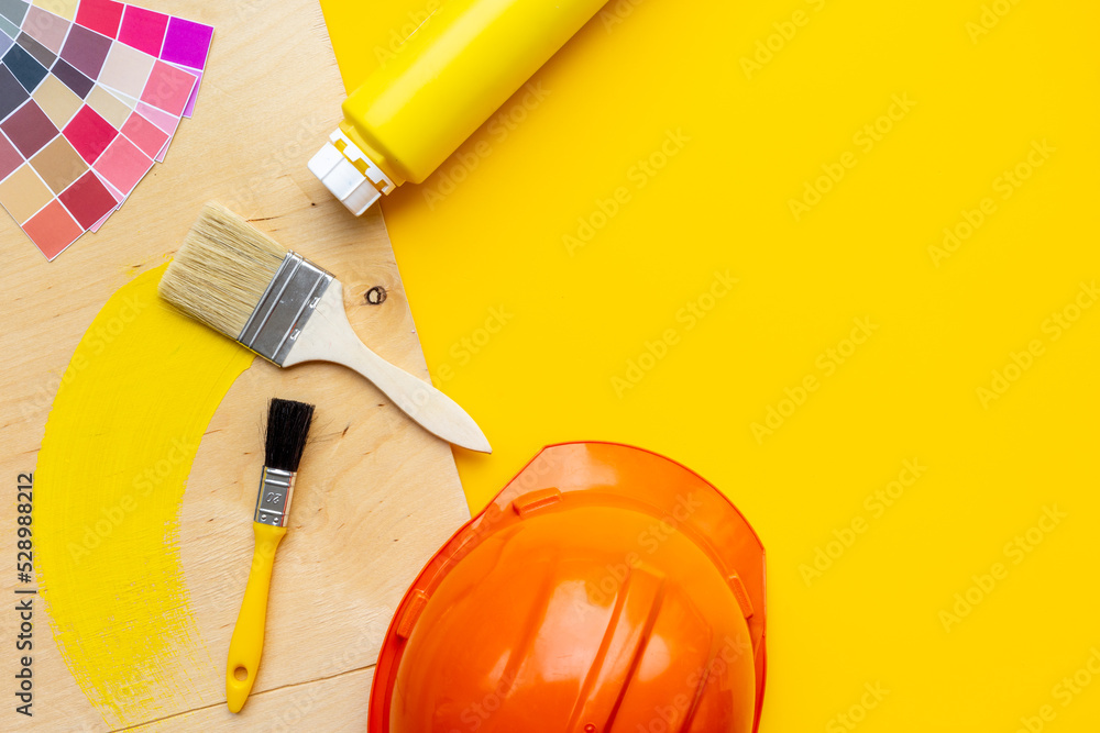 House renovation and painting background with construction helmet and ...