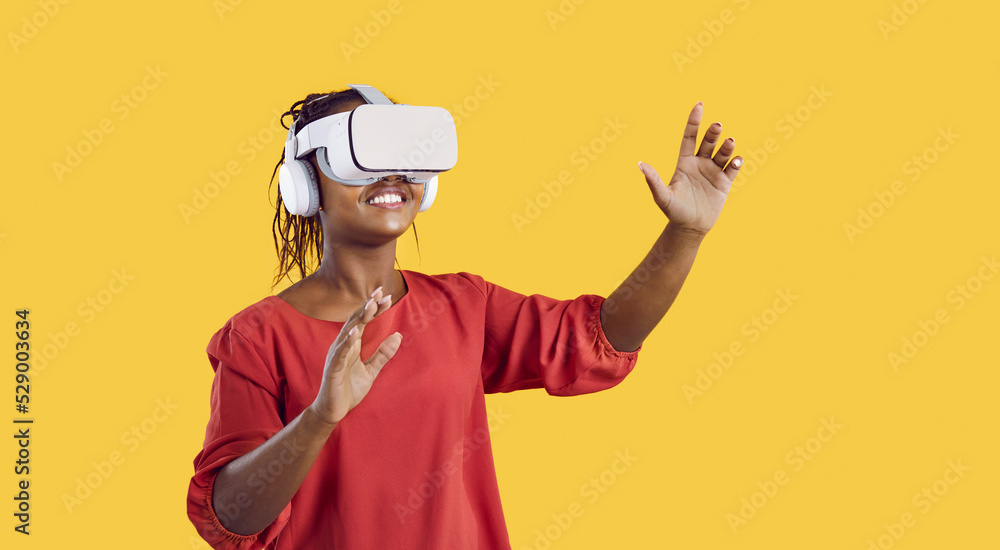 Happy woman in new VR glasses experiencing virtual reality. Young Afro ... Happy woman in new VR glasses experiencing virtual reality. Young Afro ...