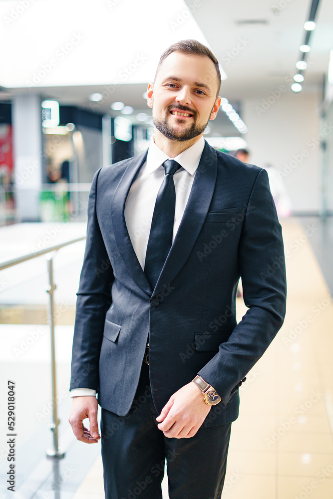 A young man with a beard dressed in a classic business suit. Young ...