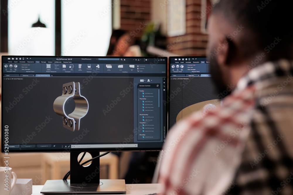 Cad engineer working with manufacturing software to develop industrial ...