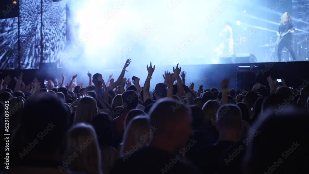 People silhouettes jump waving and clapping hands, crazy dancing with ...