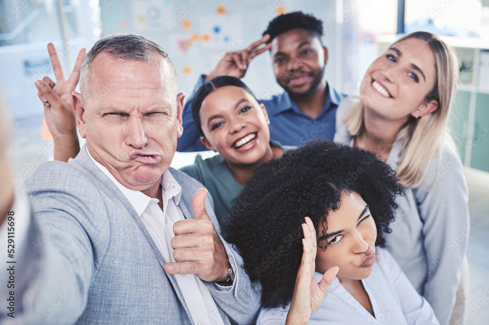 Creative, fun and business team taking a selfie together while in a ...