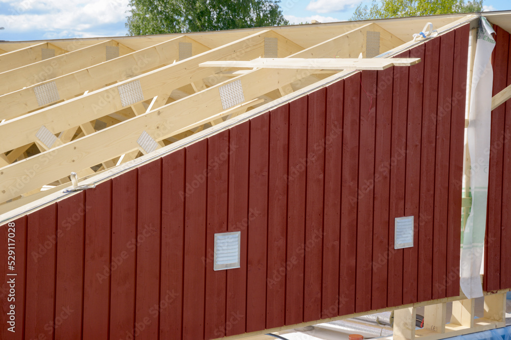 Roof timber frames being built with siding Stock Photo | Adobe Stock
