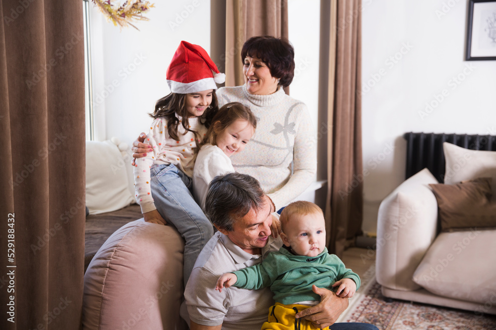 extended family grandparents and three grandchildren celebrate ...