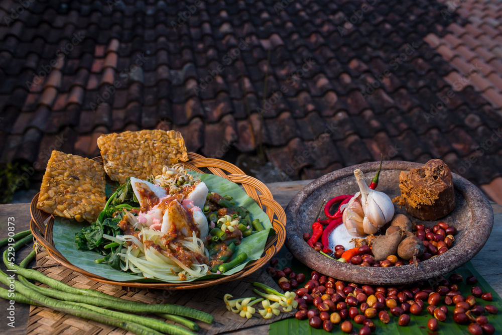traditional food of indonesia (pecel). pecal is a food that uses peanut ...