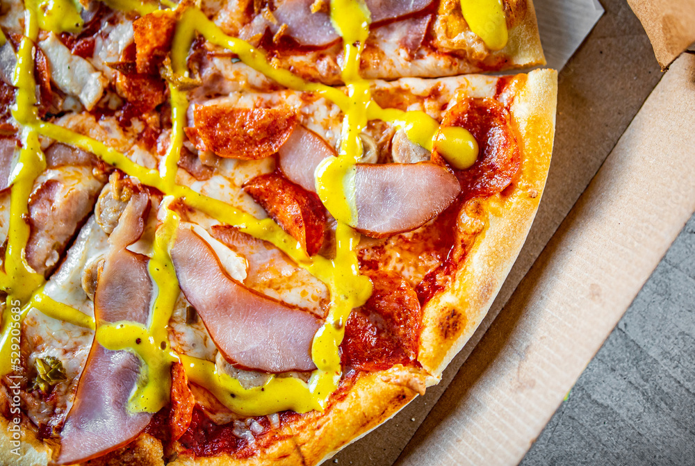 Pizza with Mozzarella cheese, ham, tomato sauce, pepper, pepperoni ...