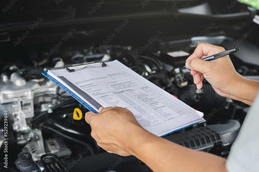 Car service concept, Close up hand car service staff check engine ...