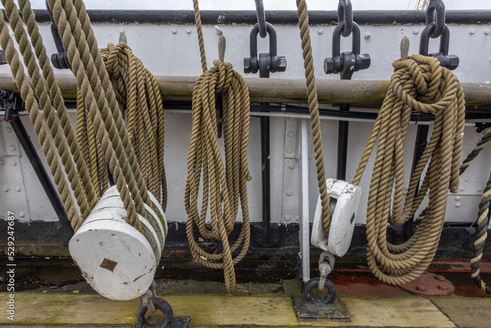 Secured rope rigging lines tied on deck of sailing ship Stock Photo ...