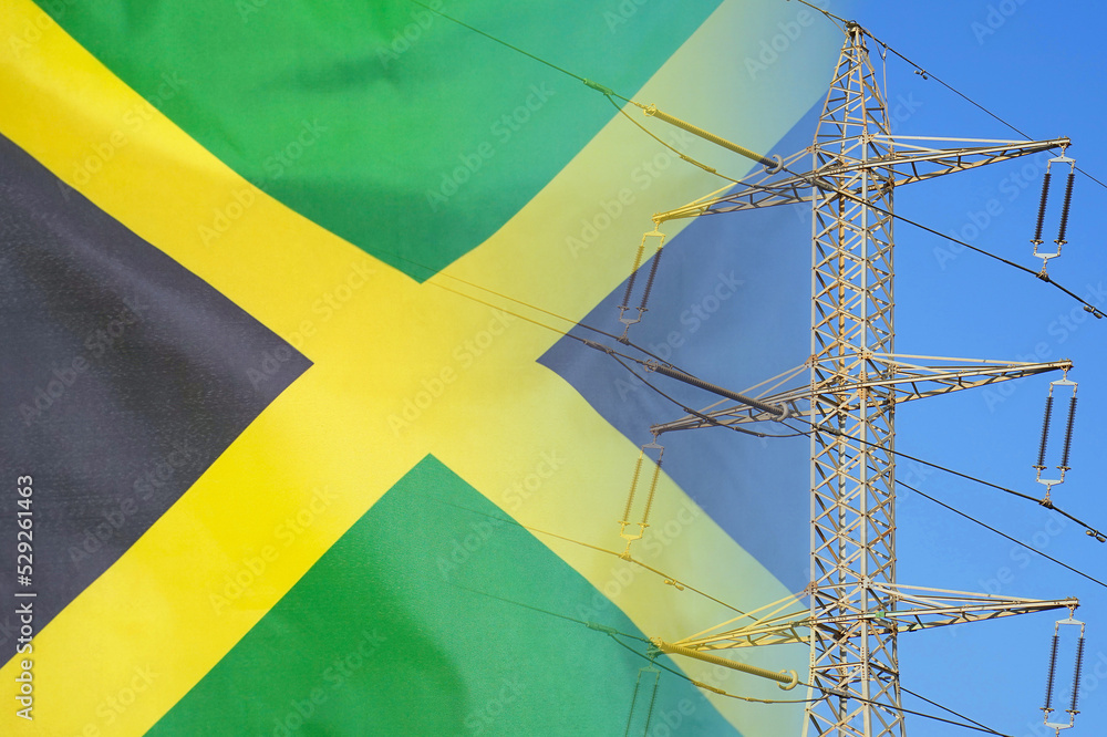 Jamaica flag on electric pole background. Power shortage and increased energy consumption in ...