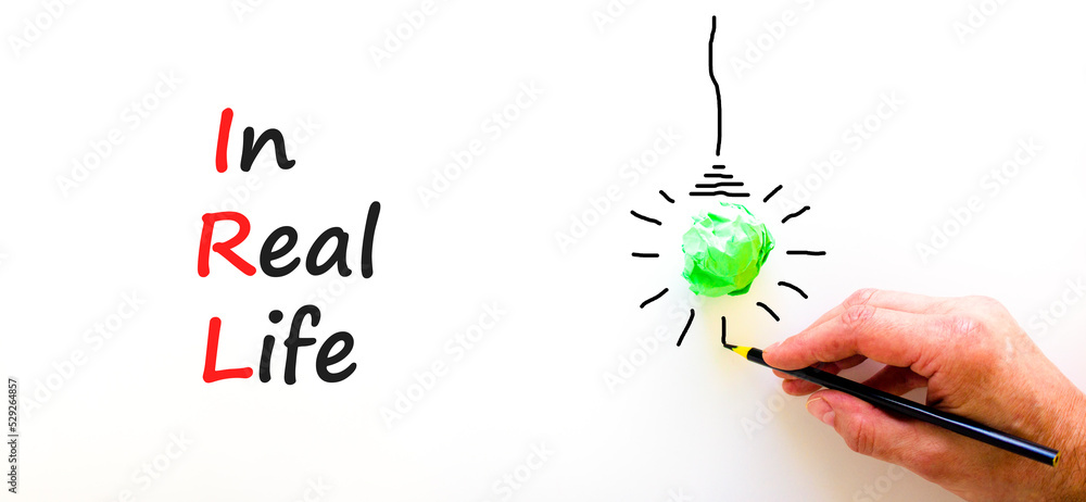 IRL in real life symbol. Concept words IRL in real life on white paper ...