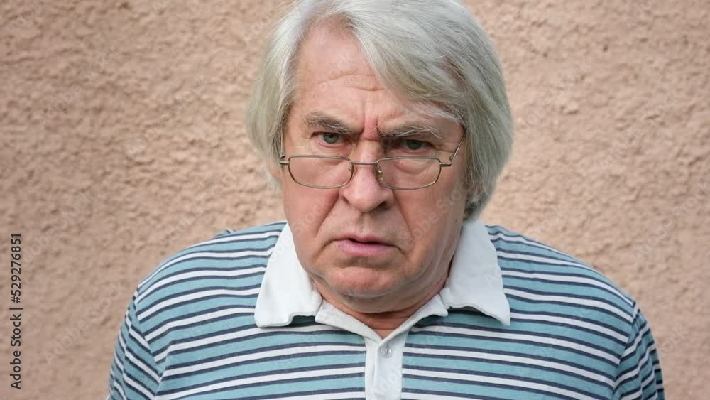 Closeup portrait of an old man, grandfather looking very unhappy, mad ...