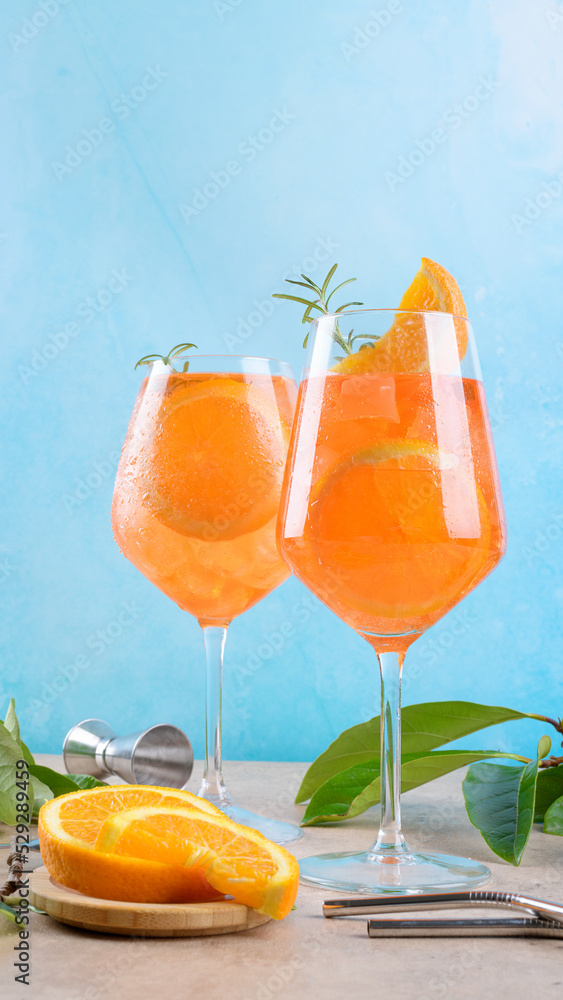 Classic italian aperitif aperol spritz cocktail in two wineglasses with ...