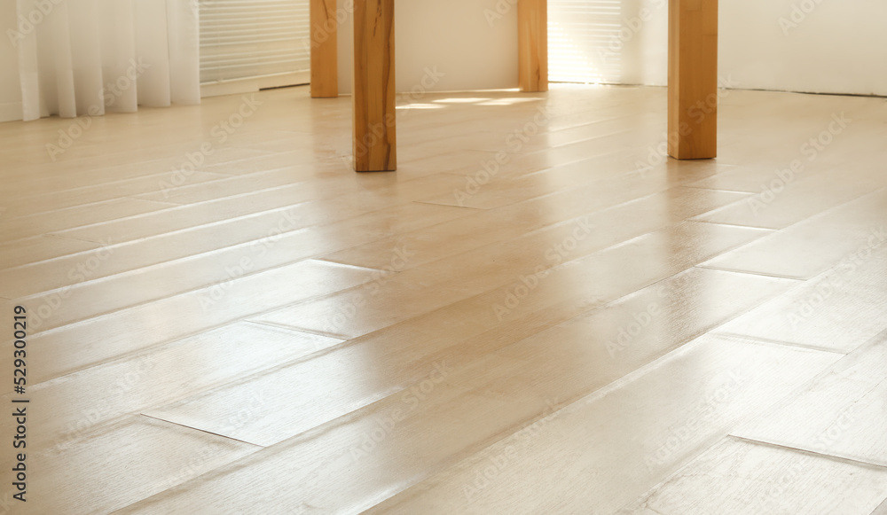 Swollen laminate flooring from flood or water damage, perspective view ...
