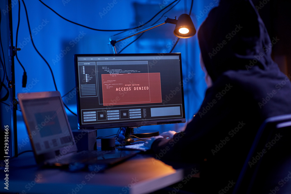 cybercrime, hacking and technology concept - female hacker in dark room ...