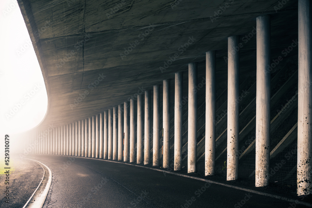 Diminishing perspective of road under bridge Stock Photo | Adobe Stock