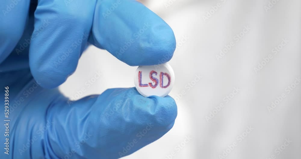 LSD pill in doctor hands, psychedelic drug for the treatment of severe ...
