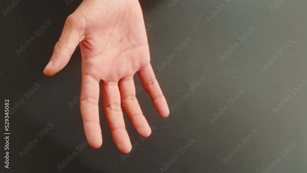 Black skin texture close-up, hand palm on black background. African ...