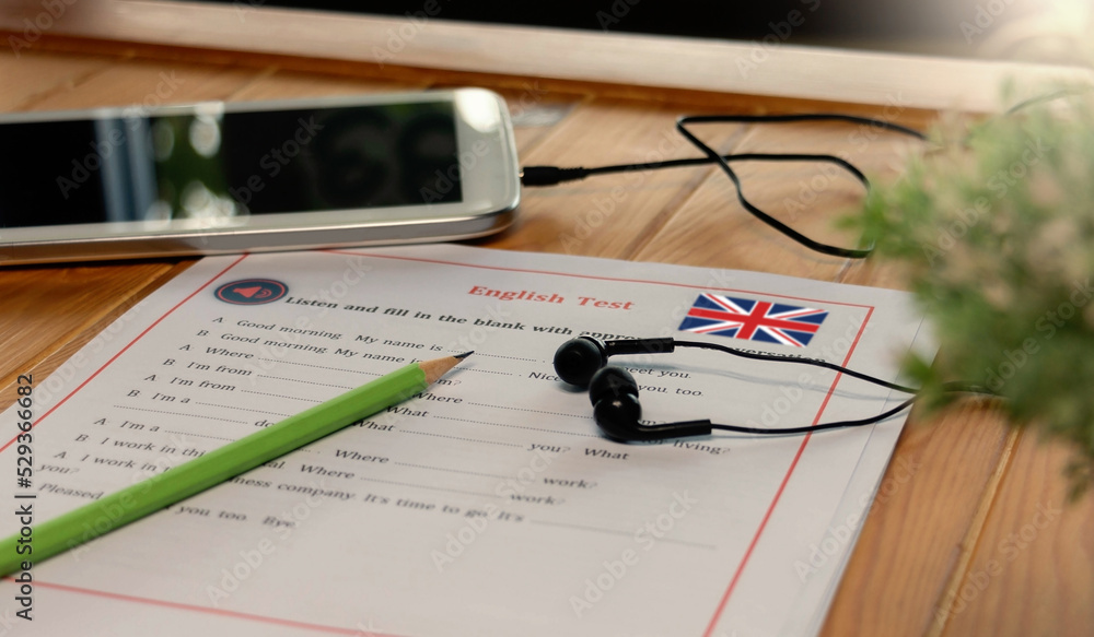 English listening test on wooden desk Stock Photo | Adobe Stock